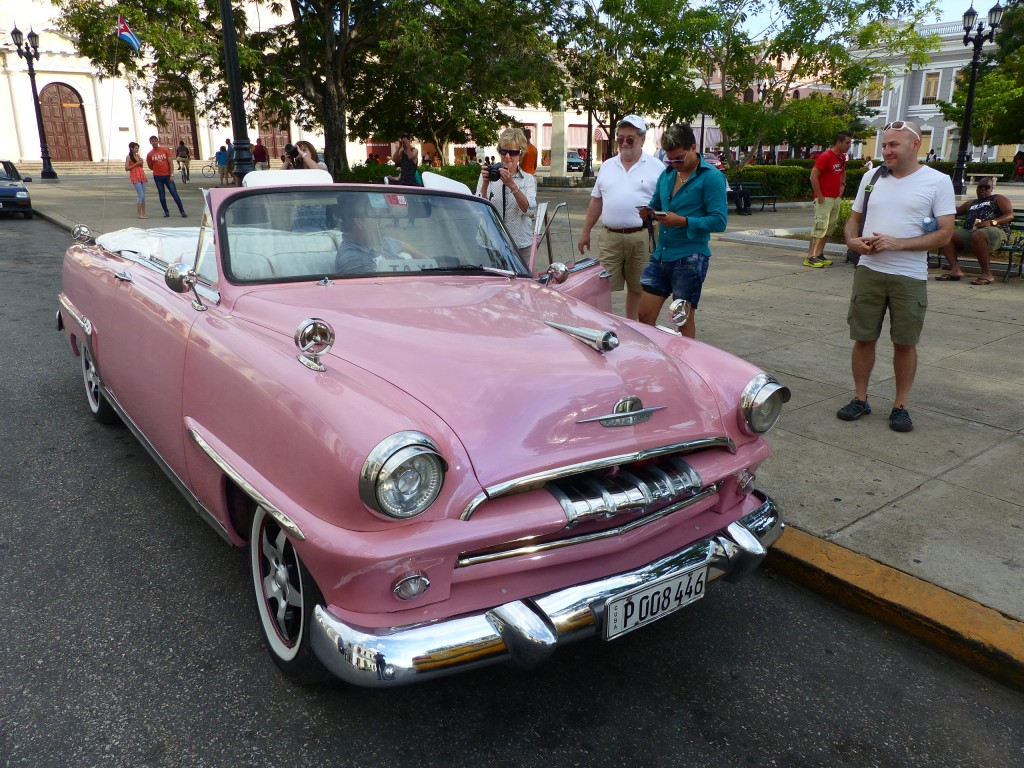 pink-plymouth-draws-crowd-in-sienfuegos-town-square - Matt Stone Cars